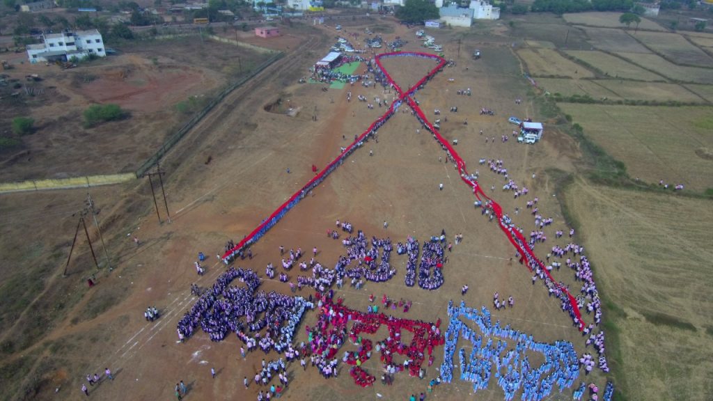 MOST STUDENTS TO HOLD NACO LOGO TOGETHER - India Book of Records