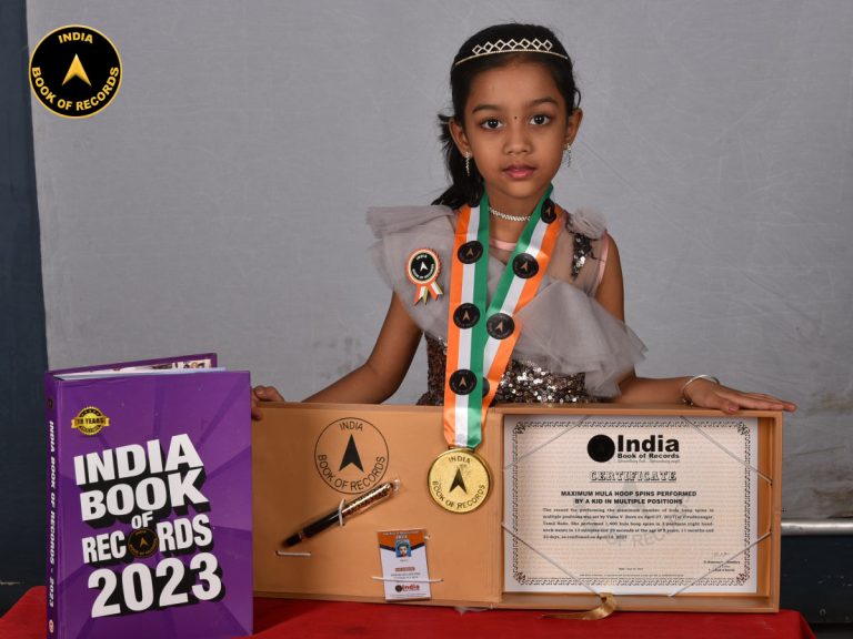 Maximum hula hoop spins performed by a kid in multiple positions ...