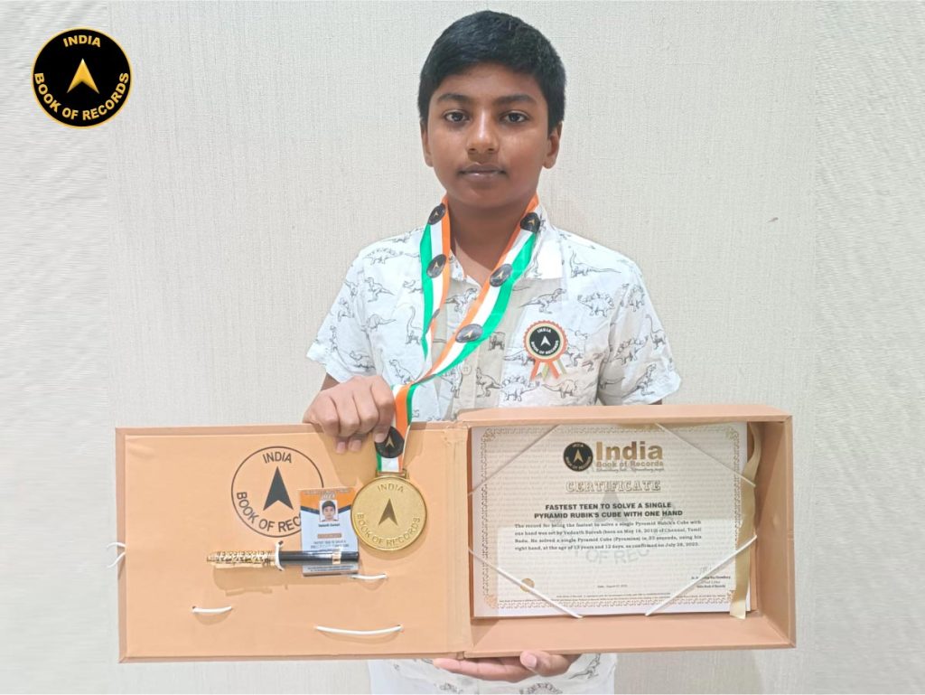 Fastest teen to solve a single Pyramid Rubik's Cube with one hand ...