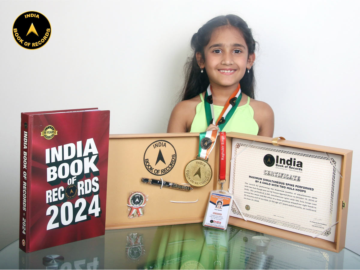 Maximum simultaneous spins performed by a child with two hula hoops ...