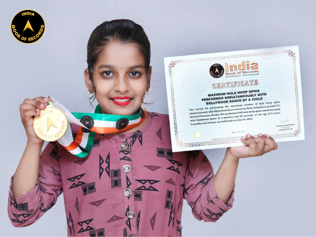 Maximum hula hoop spins performed simultaneously with Bollywood dance ...